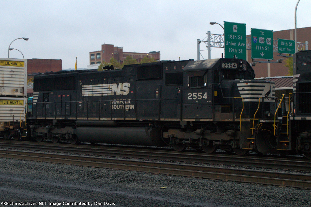NS SD70 2554 trails on 26T